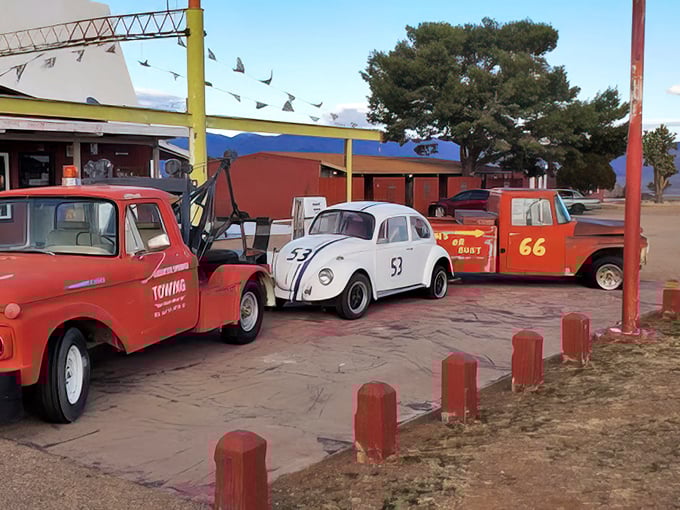 Classic cars rest in the desert sun, having completed their pilgrimage to the great green head decades ago.
