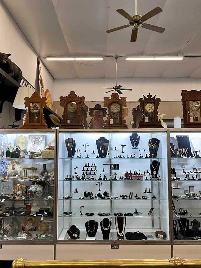 Ornate clocks tick away above gleaming jewelry displays, reminding shoppers that time spent hunting treasures is never wasted.