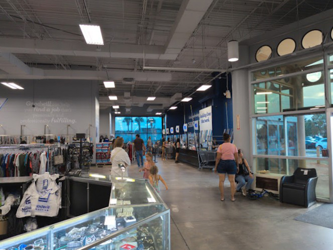 The diverse tapestry of thrift store enthusiasts—families, collectors, and budget-conscious shoppers all united in the universal joy of a great find.