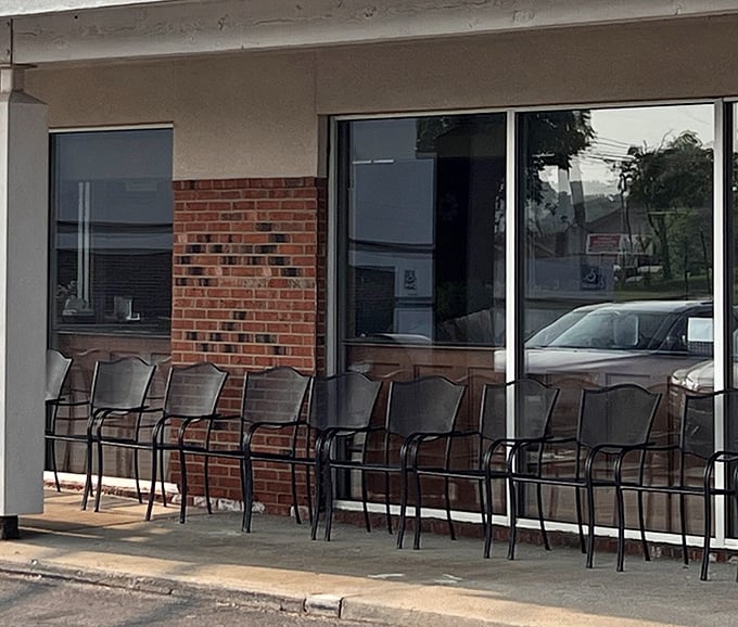 The outdoor waiting area where breakfast anticipation builds. Those chairs have heard countless "I'm so hungry" conversations.
