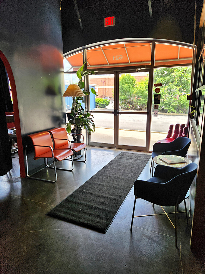 The waiting area: where anticipation builds and the orange seating practically vibrates with the promise of pancakes to come.