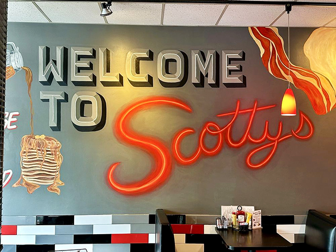 The neon welcome sign glows with promise, like a beacon guiding hungry travelers to breakfast salvation. That pancake illustration knows what you came for.