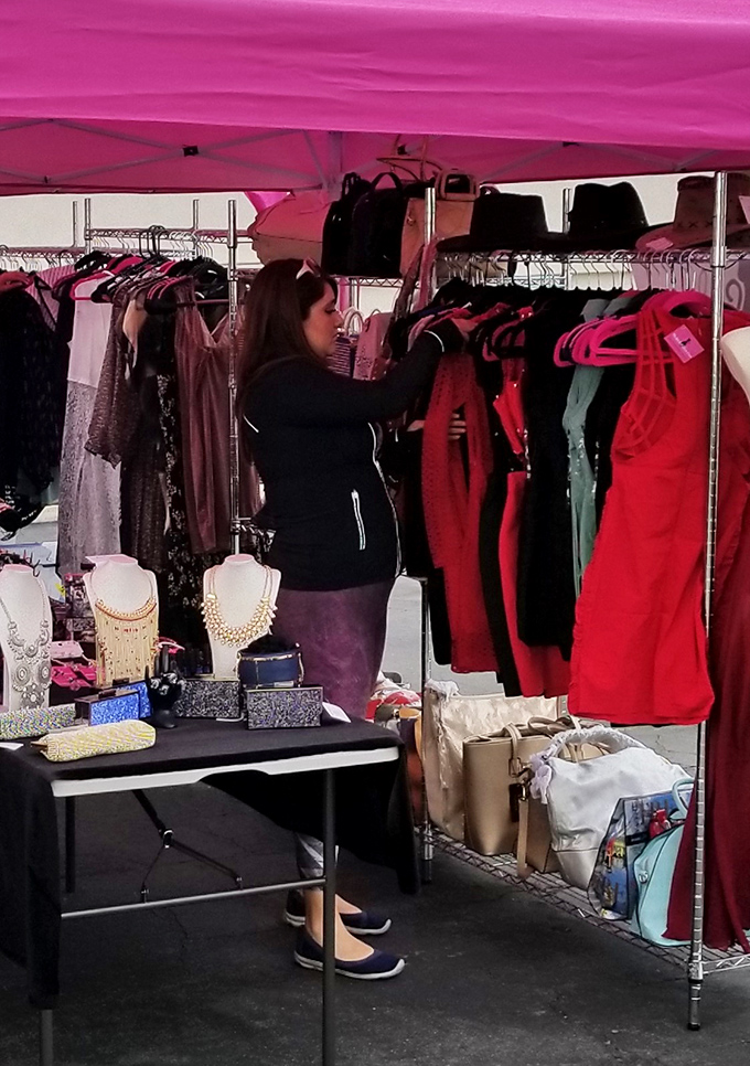 The serious business of vintage clothing hunting. This shopper's focused expression says, "I will find that perfect 1960s cocktail dress if it's the last thing I do."