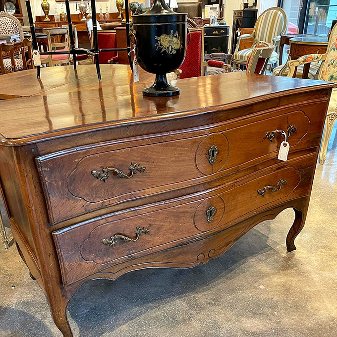 Curves in all the right places—this French commode has the kind of craftsmanship that makes modern furniture weep with inadequacy.
