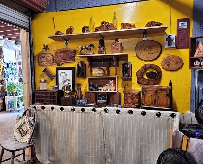Rustic wooden treasures against a sunshine-yellow wall&mdash;where handcrafted nostalgia meets Florida home d&eacute;cor in warm, earthy tones.
