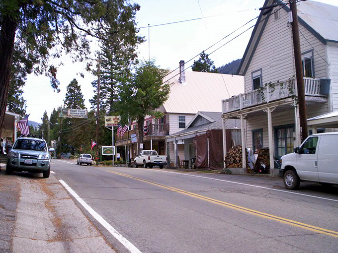 Sierra City's historic buildings huddle against the backdrop of pine-covered mountains, a postcard from California's Gold Country.