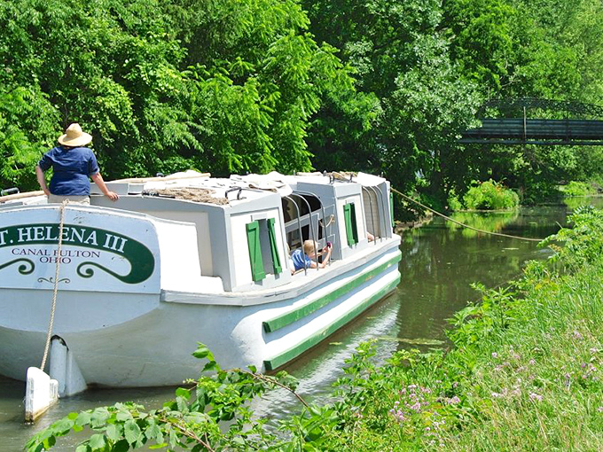The St. Helena canal boat glides through Canal Fulton's waters just as it did a century ago &ndash; history floating right before your eyes.