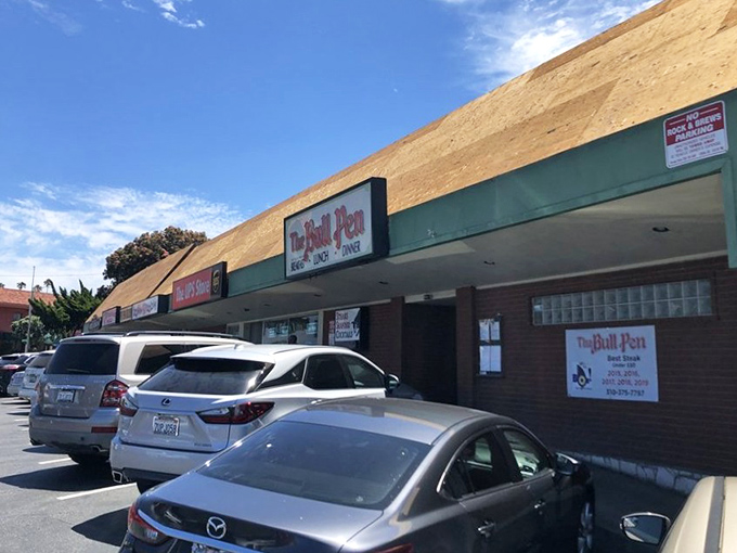 This unassuming exterior hides a time capsule of classic American dining where steaks are thick and martinis are cold.