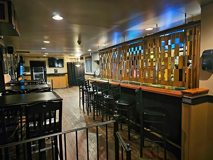 The upstairs dining area offers more seating and the same commitment to feeding you until your pants feel judgmental.