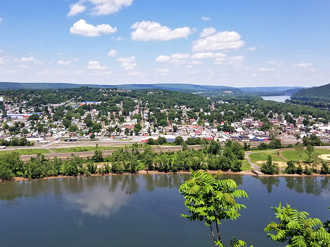 Towns nestle between river and ridge like they've always belonged there. From this height, human settlements become part of nature's grand design.