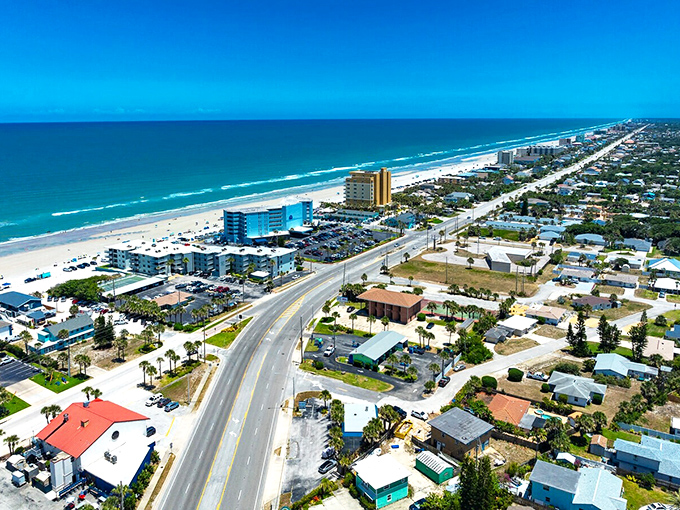 The Atlantic stretches like a blue ribbon along New Smyrna Beach, just minutes from Edgewater's more affordable neighborhoods.