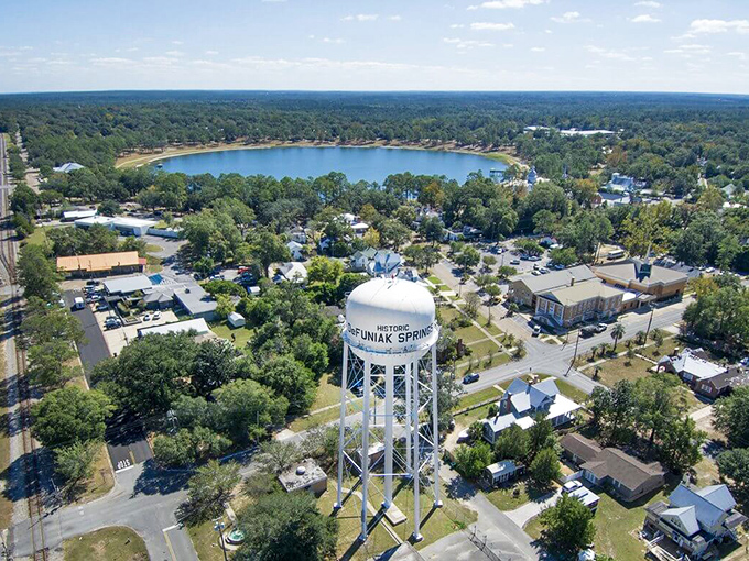 From above, DeFuniak Springs reveals its perfect symmetry. The circular lake and historic water tower creating a postcard that practically mails itself.