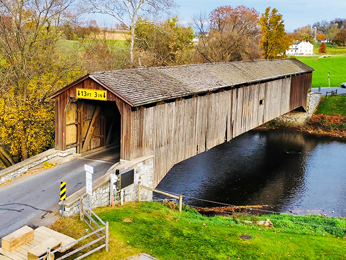 From above, the bridge reveals its perfect placement in the landscape, a human creation that somehow enhances rather than intrudes upon nature's design.