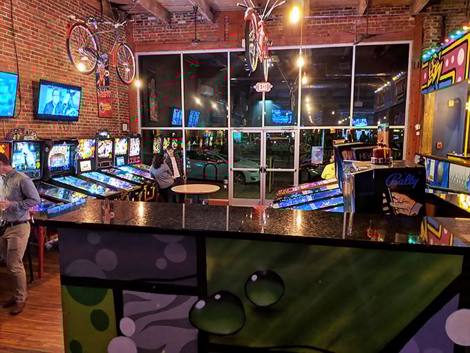 Because nothing says "complete dining experience" like washing down your pulled pork with a competitive round of pinball.