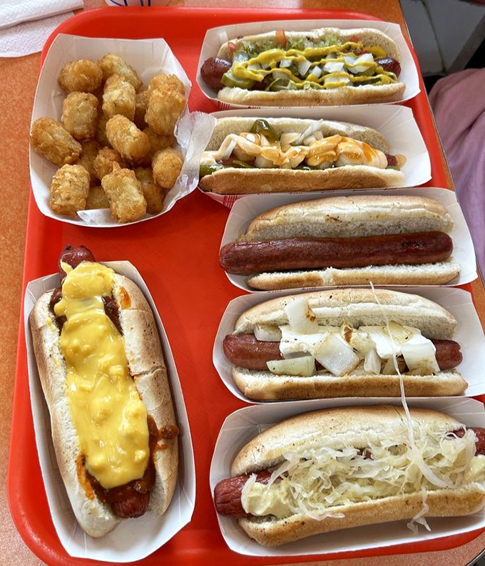 Hot dog heaven on a tray. Each one a different personality, like the Rat Pack of frankfurters, with tater tots playing the role of Dean Martin.