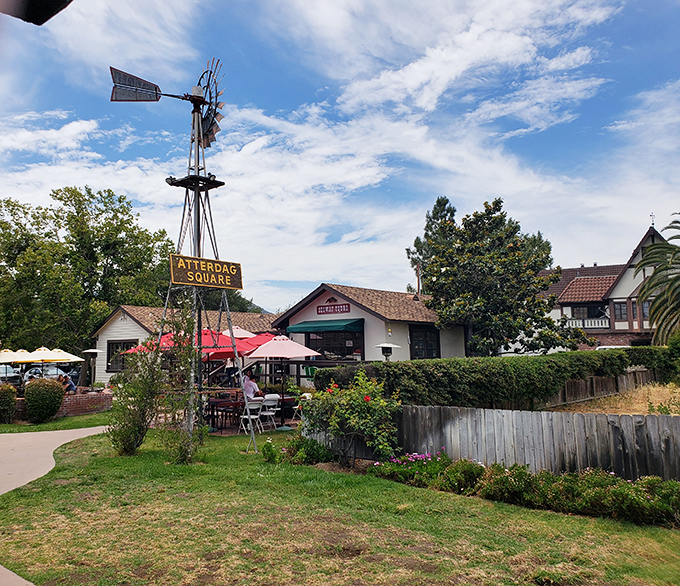 Atterdag Square's windmill stands sentinel over outdoor dining spaces where California sunshine meets Danish hospitality.