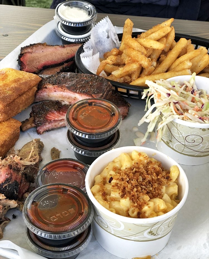 The BBQ sampler platter&mdash;where decisions are unnecessary and joy is inevitable. Brisket, ribs, sides, and the sudden realization that you need bigger pants.