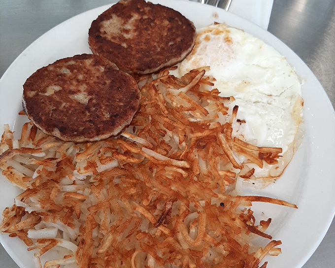 The classic American breakfast, executed with precision. Those hash browns have achieved the golden-crisp perfection that home cooks dream about.