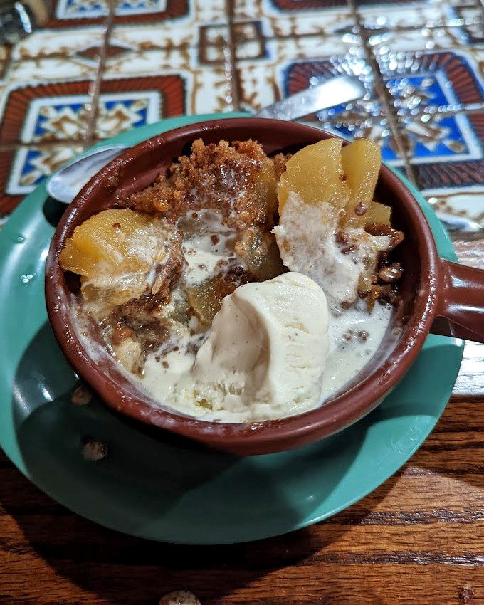 Apple crisp that's having an identity crisis between dessert and breakfast—and we're perfectly fine with that confusion. The ice cream seals the deal.
