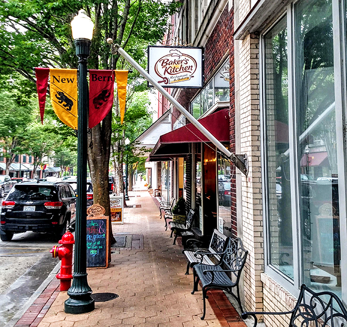 Baker's Kitchen Restaurant beckons hungry visitors with its inviting storefront. Those sidewalk benches aren't just seating&mdash;they're front-row tickets to the parade of small-town life.
