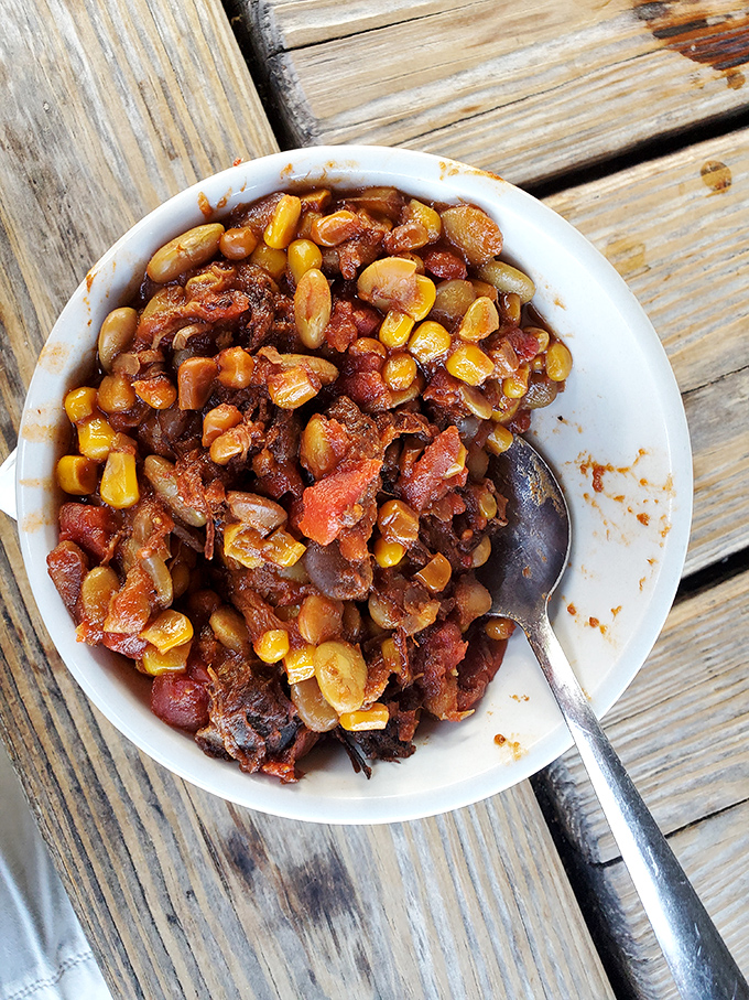 Brunswick stew that doesn't just warm your stomach&mdash;it tells Georgia's culinary story in every bean, corn kernel, and tomato-soaked bite.