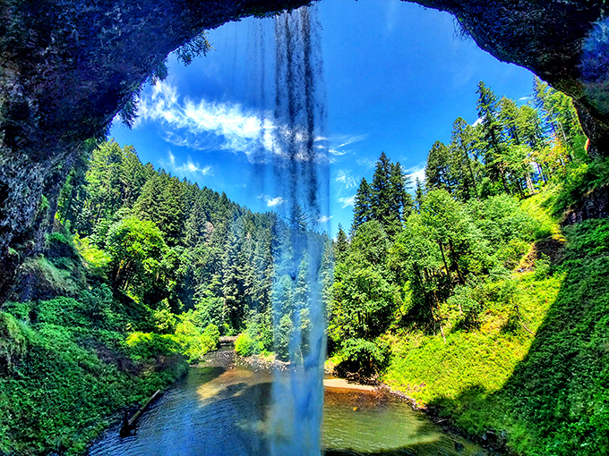 The ultimate reveal: Looking out from behind the waterfall offers a perspective that turns visitors into explorers and tourists into adventurers.