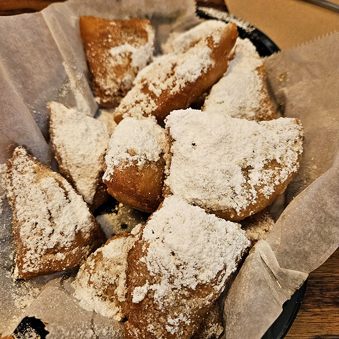 Beignets showered with powdered sugar—like little pillows of fried dough that fell from heaven and landed in New Orleans before vacationing in Florida.