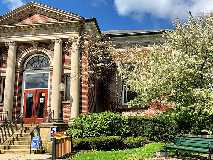 The Benson Memorial Library stands as Titusville's intellectual heart, where knowledge and community converge behind classical columns.