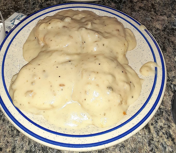Biscuits and gravy that would make your Southern grandmother nod in approval—a creamy, peppery blanket covering pillowy biscuits with comforting authority.