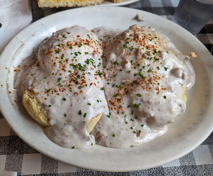 Biscuits hiding under a creamy avalanche of gravy. This isn't just breakfast&mdash;it's edible therapy for whatever ails you.