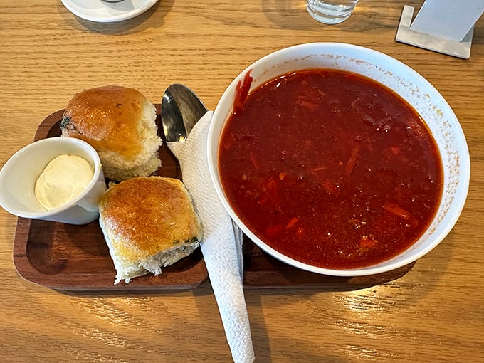 Hearty borscht served with fresh-baked rolls and butter. This soul-warming soup proves Cr&eacute;me de la Cr&eacute;me excels beyond the pastry case.