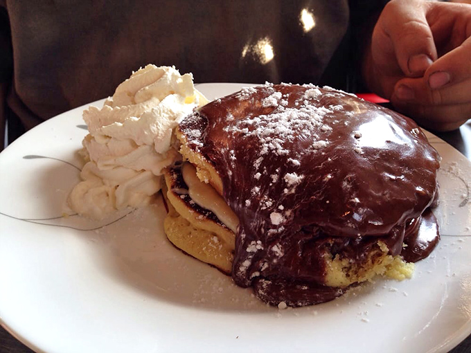 Boston cream pancakes that blur the line between breakfast and dessert. The chocolate sauce isn't asking permission&mdash;it's making a statement.