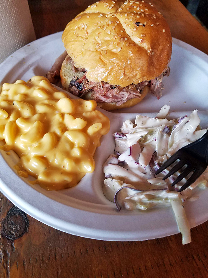The perfect barbecue sandwich doesn't exi&mdash; Oh wait, here it is. Tender meat, golden bun, with mac and slaw standing by for backup.