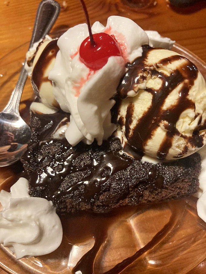 A brownie sundae that doesn't just end your meal&mdash;it creates a chocolate exclamation point. The cherry on top isn't just garnish; it's the traditional crown of dessert royalty.