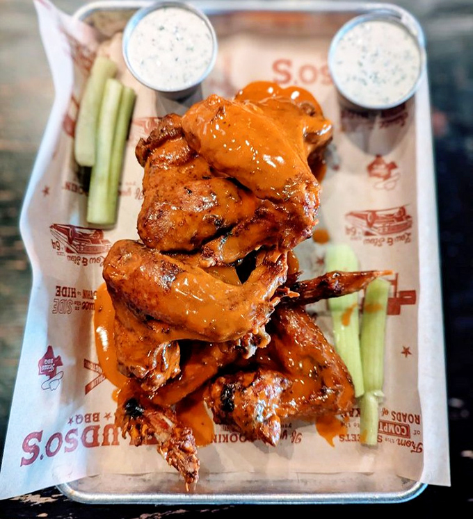 These buffalo wings aren't just coated in sauce&mdash;they're baptized in it. The celery sticks aren't garnish; they're necessary cooling agents for the flavor inferno.