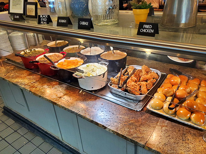 The buffet line&mdash;where dreams are made and diets go to die. Golden fried chicken, fresh rolls, and sides for days await your eager plate.