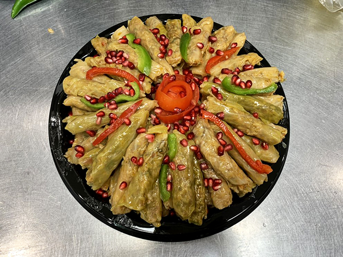 A colorful arrangement that proves vegetables can be the star of the show. These stuffed cabbage rolls are adorned with pomegranate jewels for both flavor and beauty.