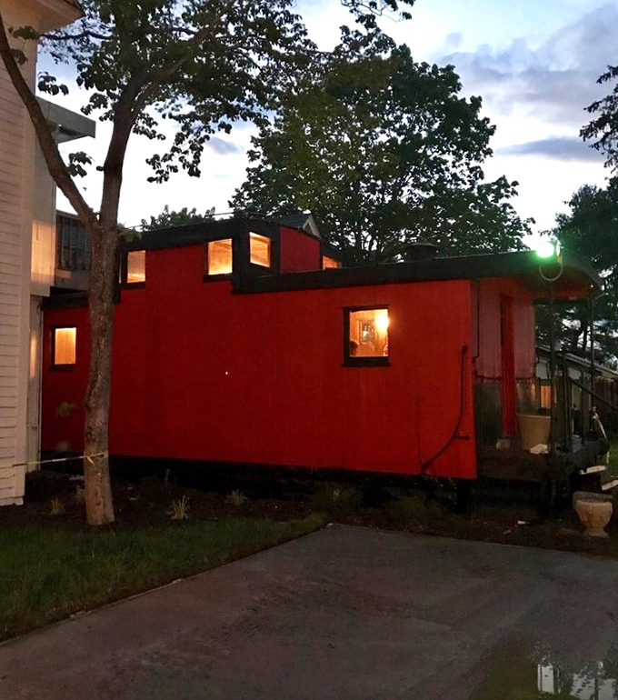 The red caboose isn't just quirky architecture&mdash;it's a dining space that promises your meal will be anything but ordinary.