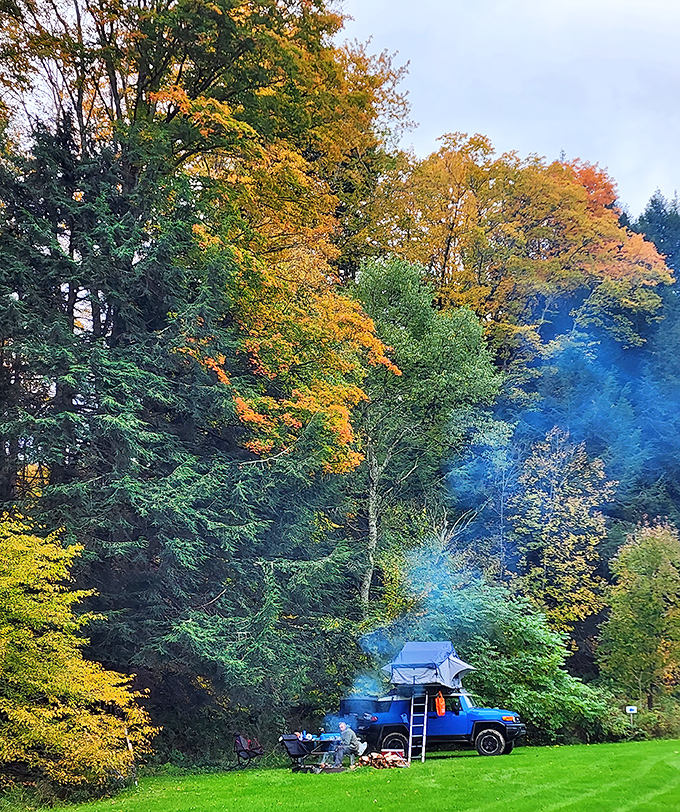 Camping beneath fall's golden canopy, with smoke curling through technicolor leaves&mdash;this is why glamping was invented for those who hate roughing it.
