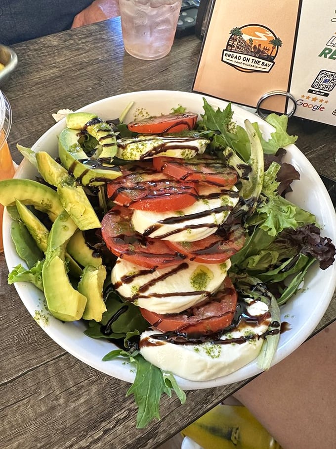 A Caprese salad that looks like it just returned from a semester abroad in Italy. Those balsamic drizzles aren't just decoration&mdash;they're flavor roadmaps.