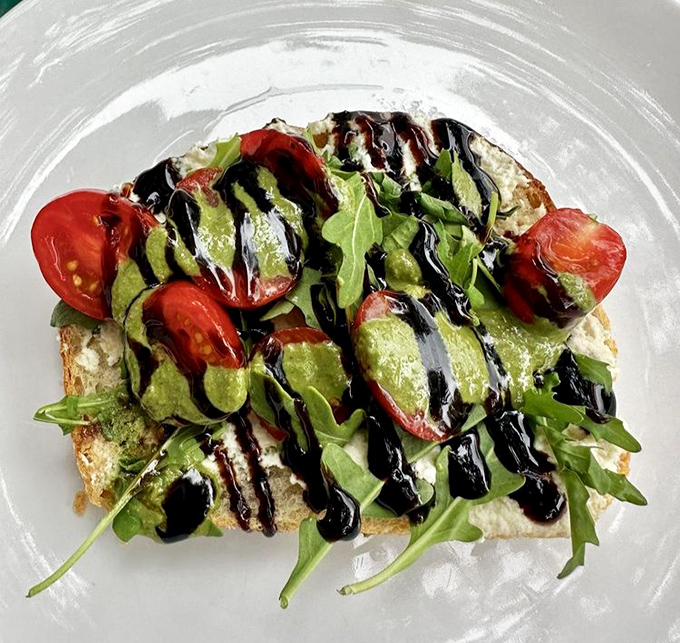 Avocado toast elevated from basic to brilliant with balsamic drizzle and fresh tomatoes&mdash;proof that simple ingredients can create extraordinary flavors. 