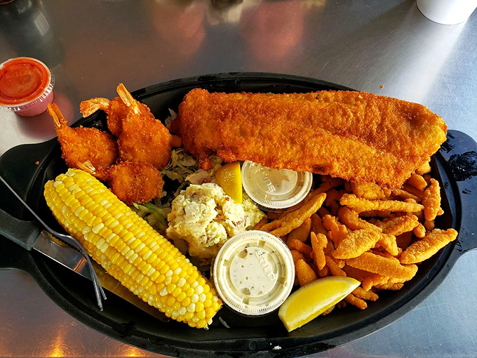 The Captain's platter that launches a thousand food comas. Golden-fried seafood, sweet corn, and those legendary waffle fries create a maritime feast.