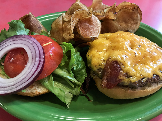 A cheeseburger that doesn't need fancy toppings to impress – just perfectly melted cheese, fresh veggies, and a bun that knows its supporting role.