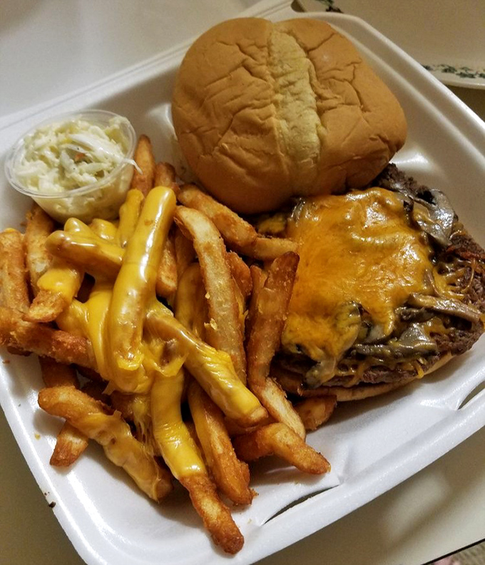 This isn't just a cheeseburger&mdash;it's a masterclass in diner perfection with golden fries and cheese that drapes like a yellow velvet curtain.