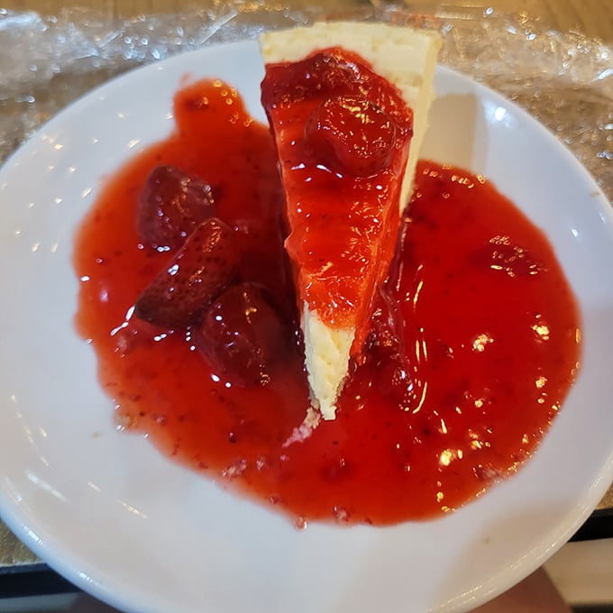 That's not just cheesecake&mdash;it's the sweet finale to your seafood symphony. The strawberry topping adds the perfect crimson curtain call.