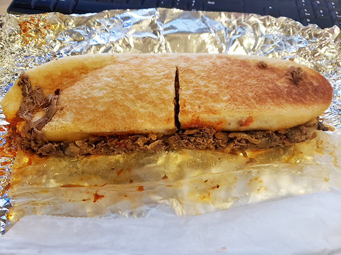 Behold the cheesesteak in its natural habitat&mdash;foil-wrapped perfection that makes Philadelphia nervous about its sandwich supremacy.