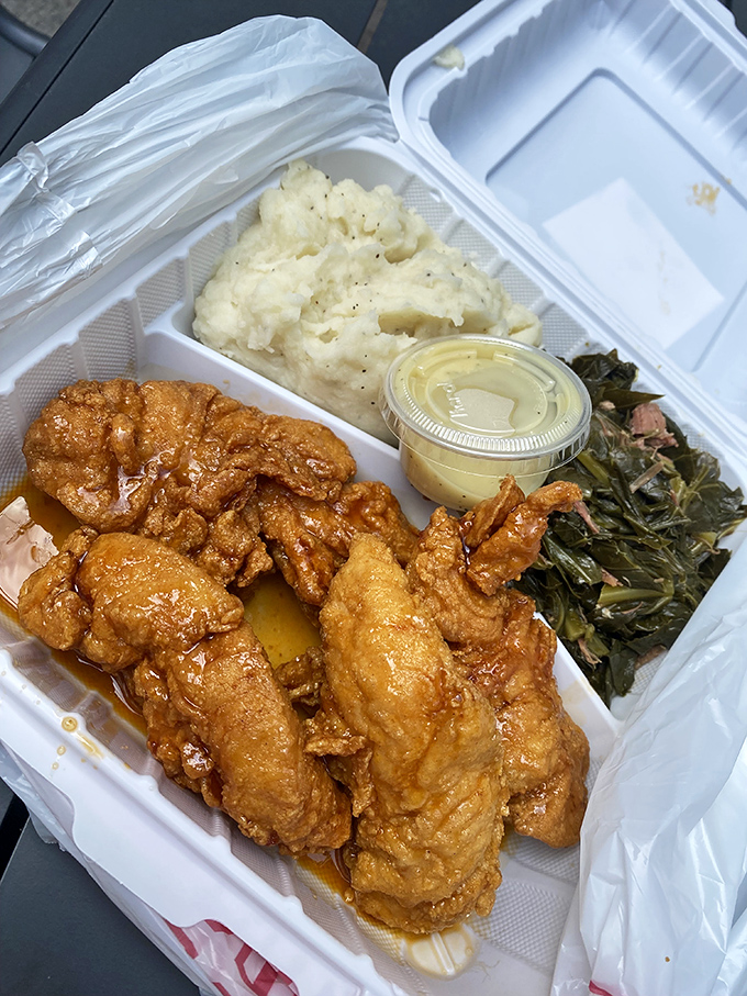 This isn't just takeout; it's a complete Southern feast in a box. The honey-glazed tenders, mashed potatoes, and greens create a portable happiness package.