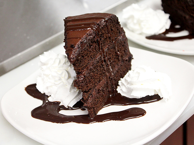A slice of chocolate cake so rich and decadent it should come with its own tax bracket and warning label.
