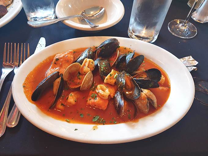 Cioppino that's essentially a seafood party in a bowl. The kind of dish that makes you want to high-five the chef.