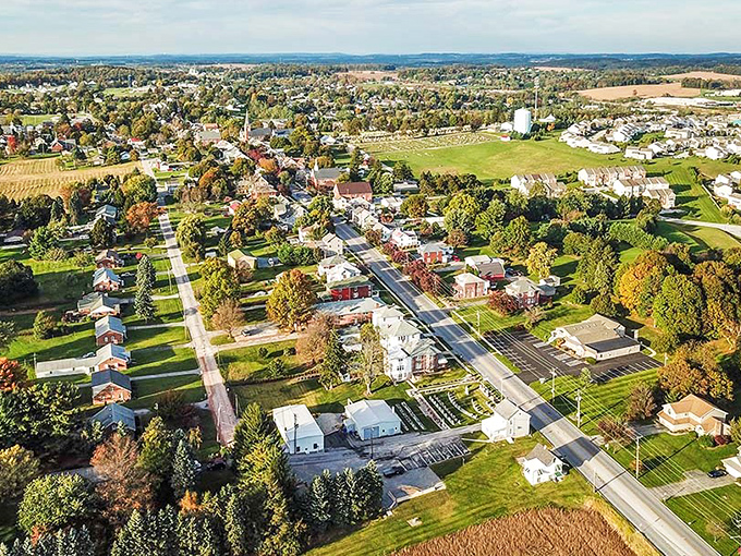 Clearfield unfolds from above like a model railroad town come to life. This aerial view reveals how harmoniously the community nestles into Pennsylvania's rolling landscape.